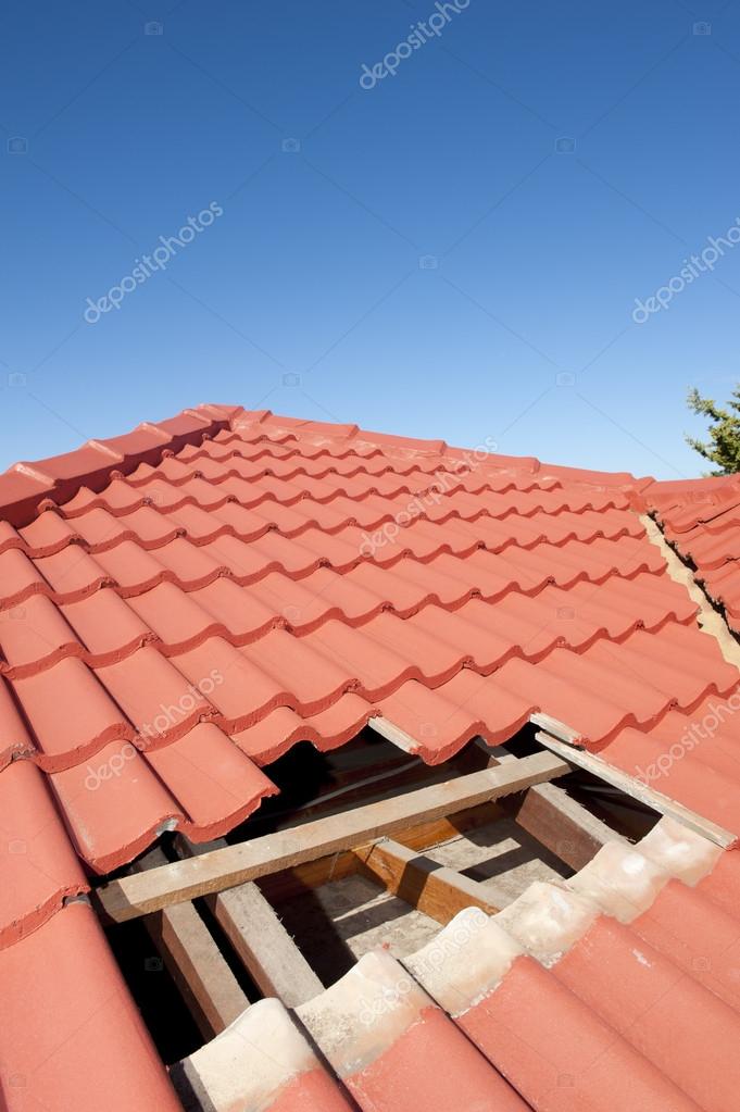 Damaged red tile roof construction — Stock Photo © roboriginal #19661007