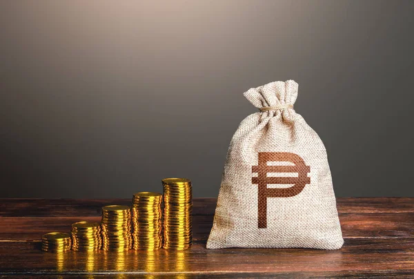 Philippine peso money bag and increasing stacks of coins. Savings. Rise ...