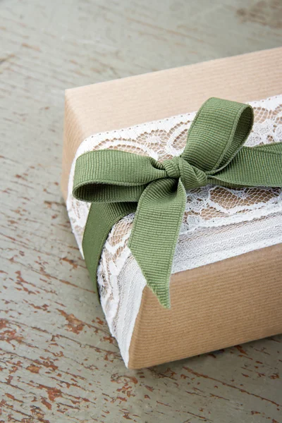Simple decorative gift box wrapped in brown eco paper and lace - Stock ...