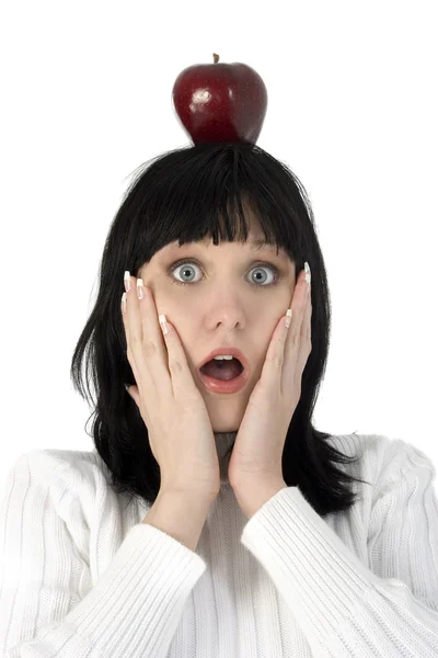 Teen girl holding an apple on her head as a target Stock Photo by ...