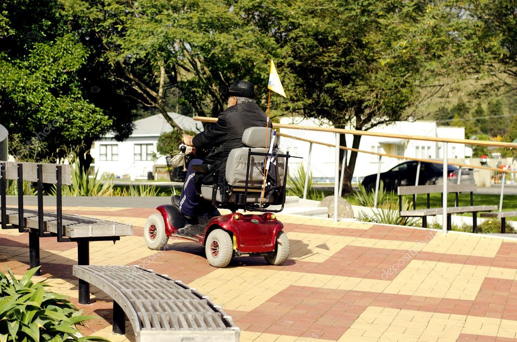 Elderly man drive mobility scooter — Stock Photo © lucidwaters #29975709