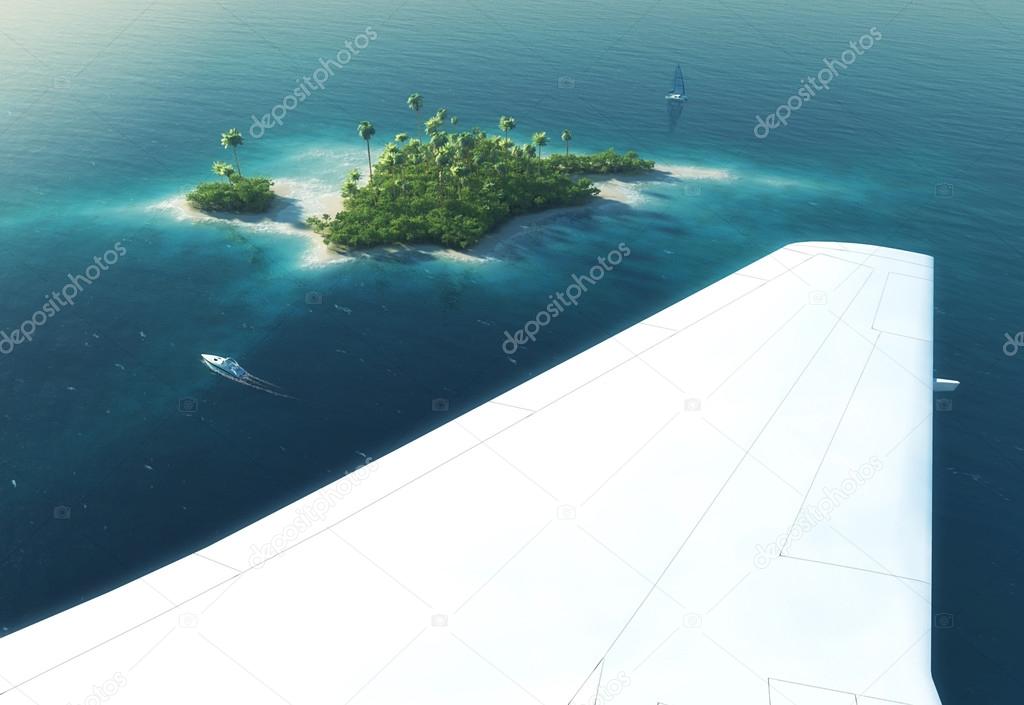 Wing of an airplane flying above paradise tropical island Stock Photo ...
