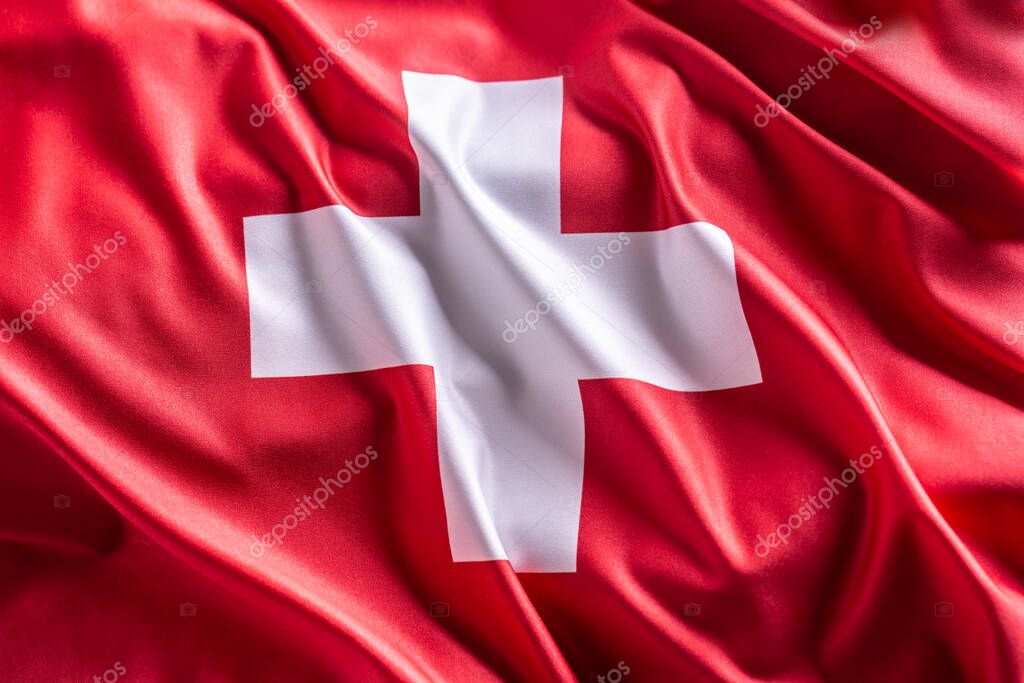ondeando la bandera de Suiza. Símbolo nacional del país y del Estado. 2023