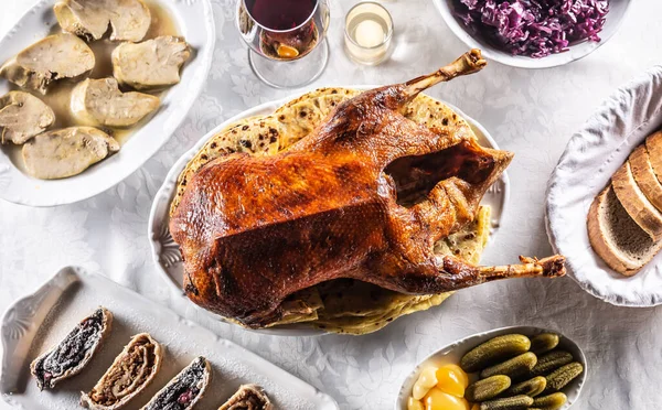 Roast goose with side dishes, red cabbage, roast, strudel, potato ...