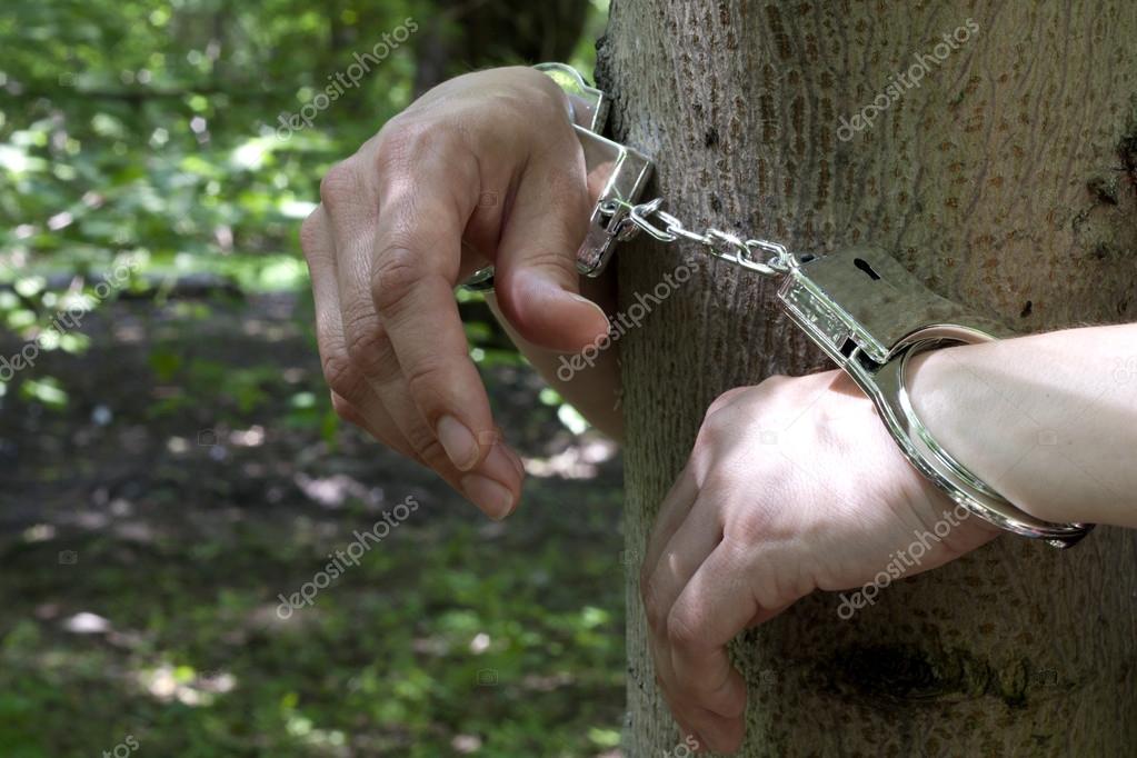 Woman tied to a tree in the forest Stock Photo by ©udra 27608305