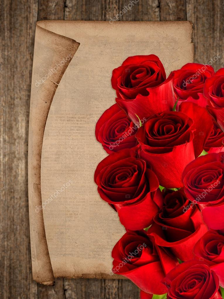 Bouquet of red roses and vintage paper sheet Stock Photo by ...