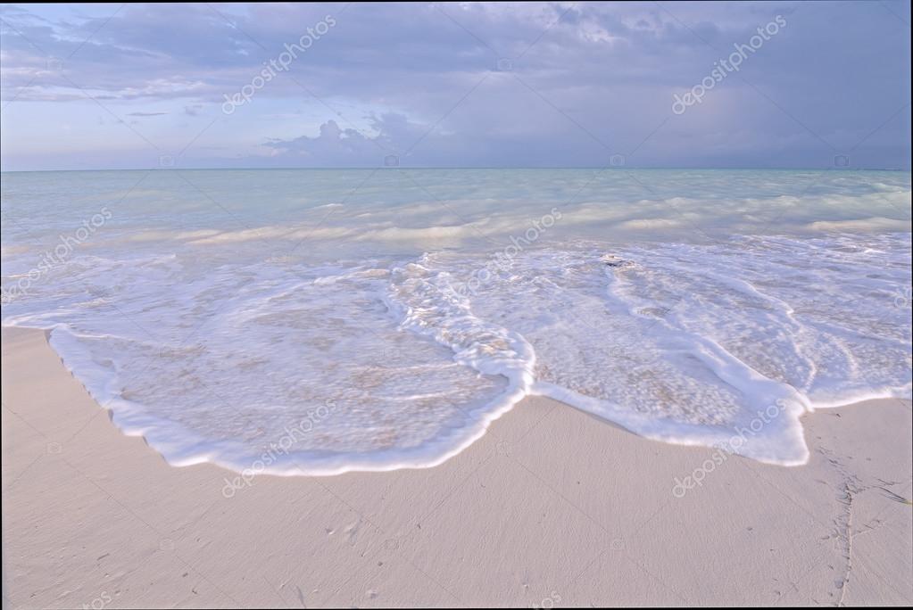 Caribbean waves lapping on beach Stock Photo by ©czuber 48359633