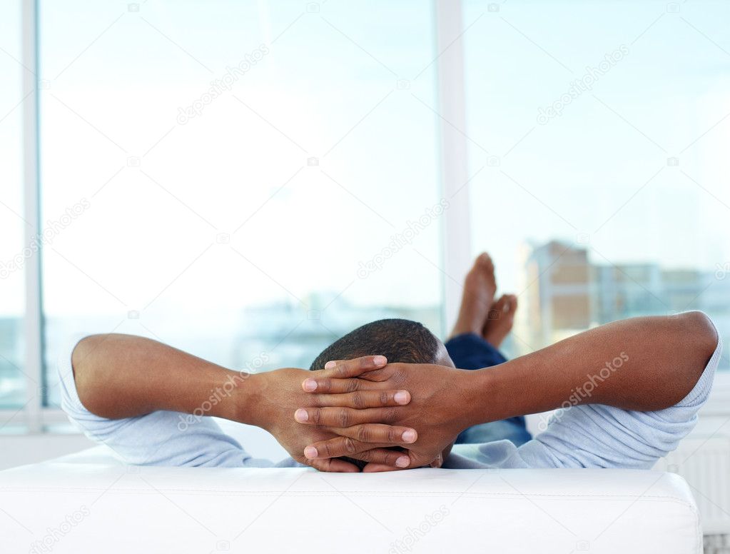 Resting on sofa — Stock Photo © pressmaster #19221051