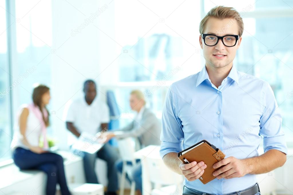 Man with notepad Stock Photo by ©pressmaster 21187061