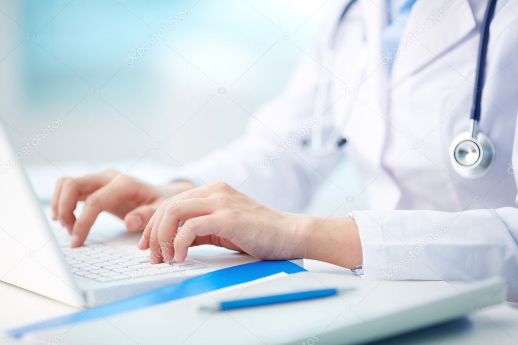 Medical person typing Stock Photo by ©pressmaster 28276819