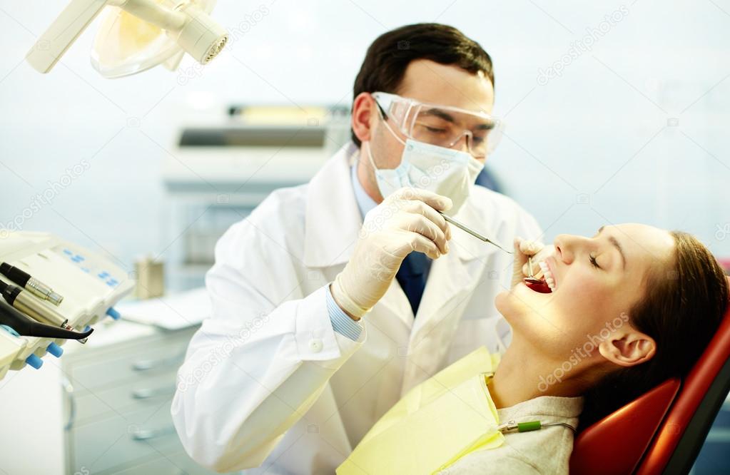 Checking up teeth — Stock Photo © pressmaster #29874447