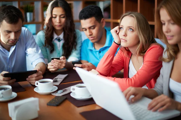 Friends using modern gadgets - Stock Image - Everypixel
