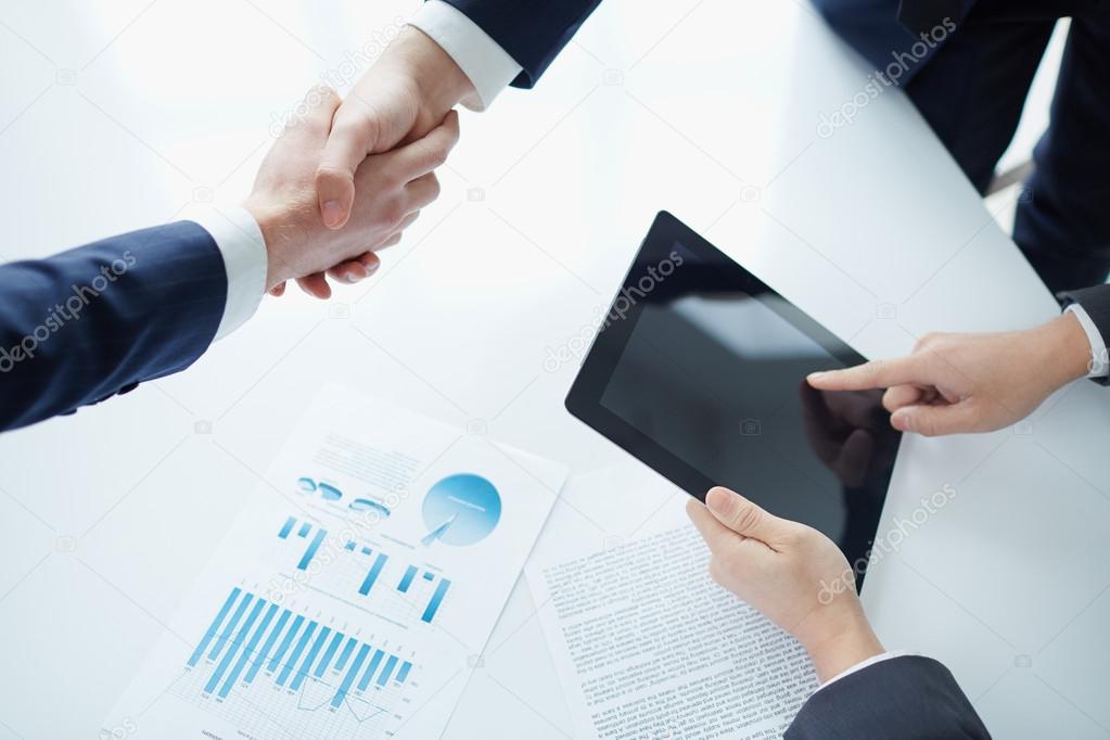 Managers shaking hands Stock Photo by ©pressmaster 46270743