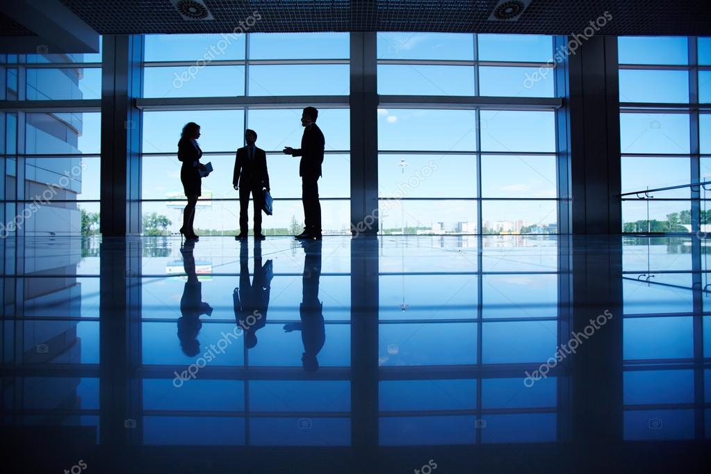 Office workers standing by the window — Stock Photo © pressmaster #51558141