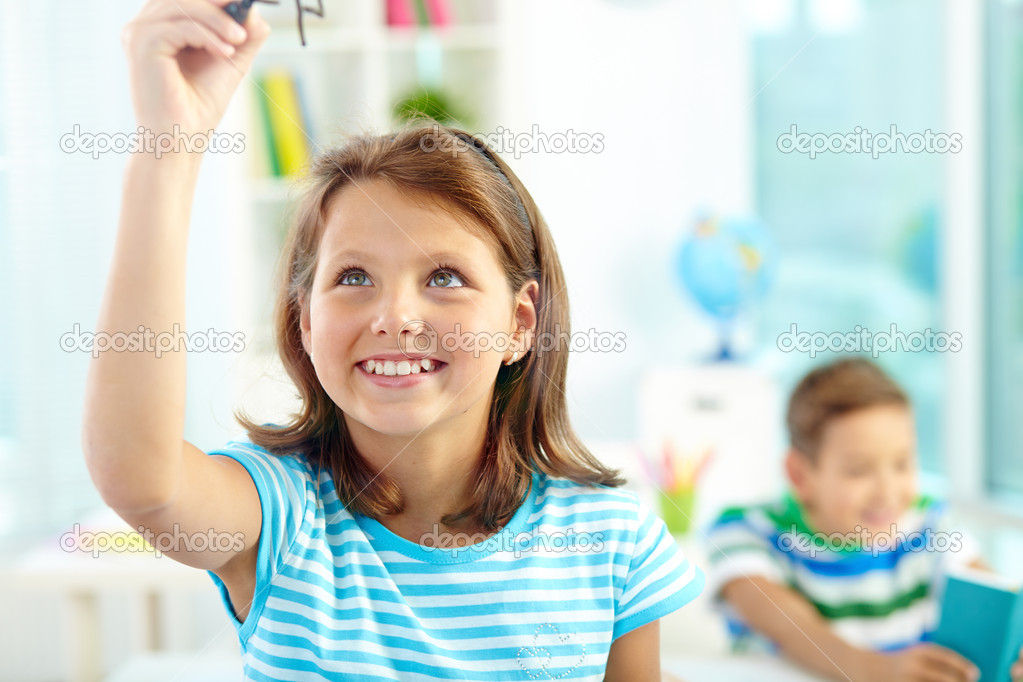 Girl doing sums on transparent board Stock Photo by ©pressmaster 51565543