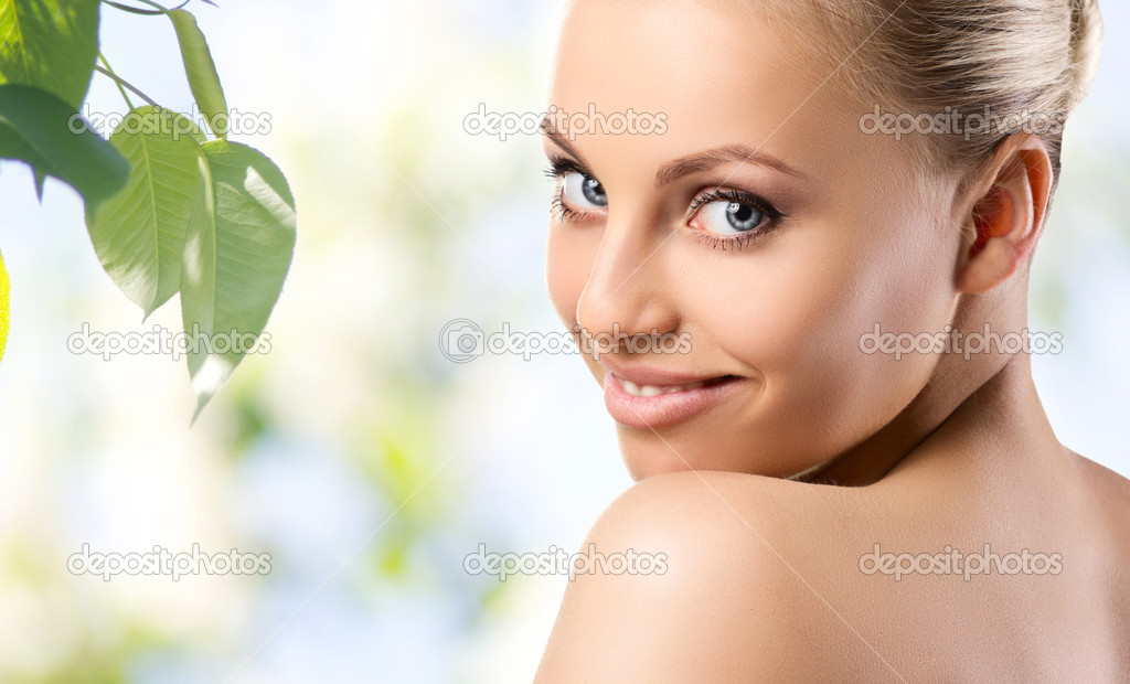 Youth smailing woman and leaf Stock Photo by ©zaretskaya 25441995