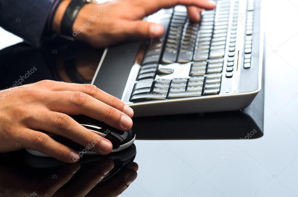 Man's hands working with computer mouse and computer keyboard Stock ...
