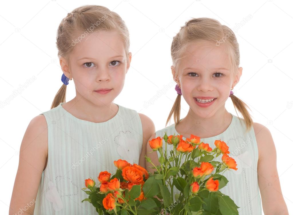 Two charming girls with bouquets of roses. — Stock Photo © lotosfoto1 ...