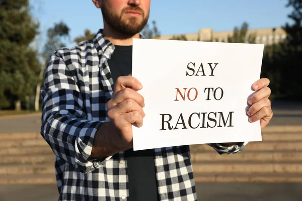 Young Man Holding Sign Phrase Stop Racism White Background — Stock ...