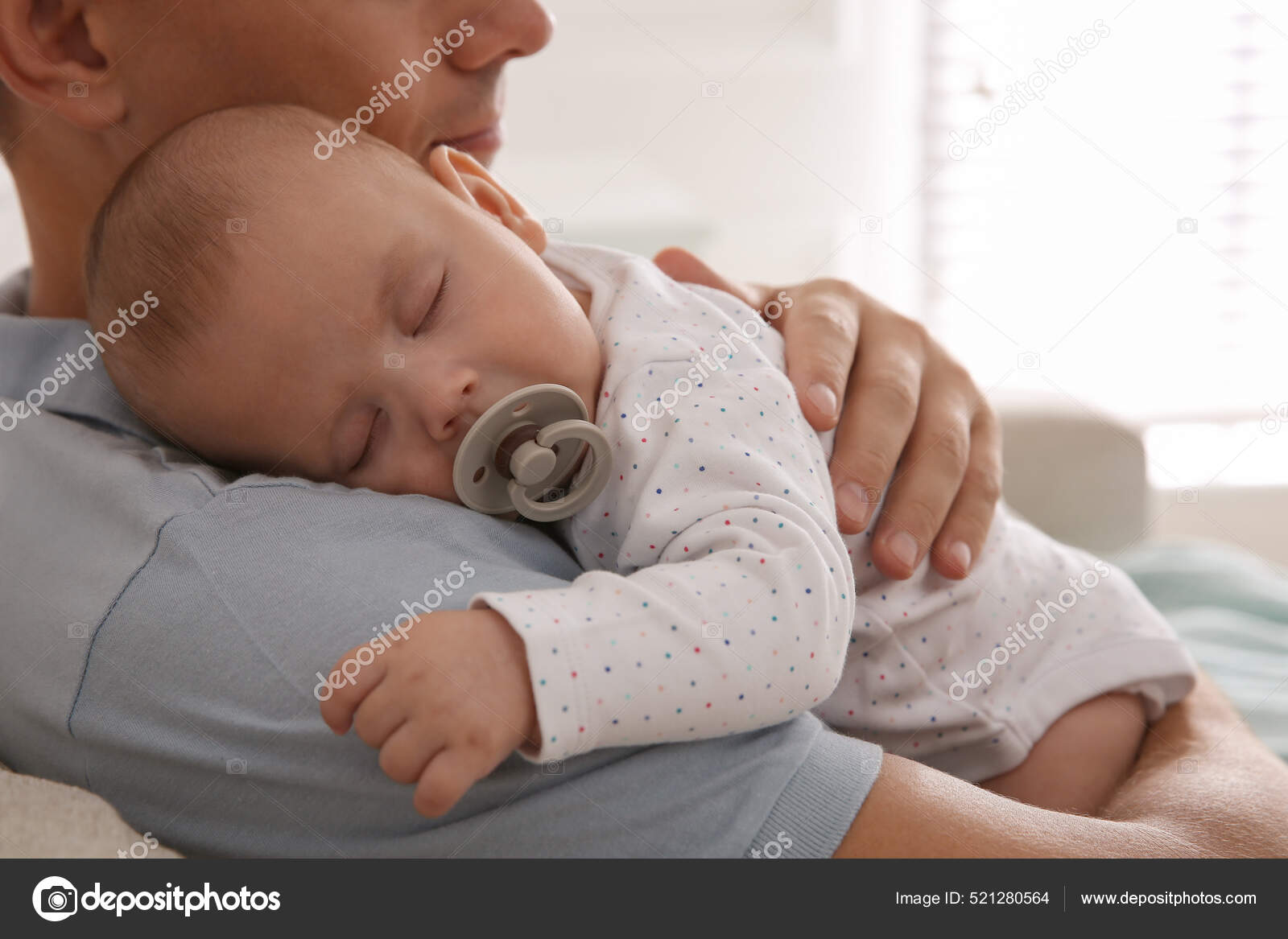 Mother And Father Sleeping With Baby