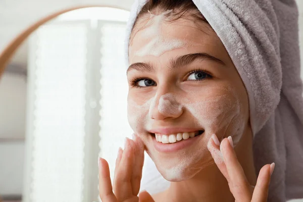 Beautiful Teenage Girl Applying Cleansing Foam Face Bathroom Skin Care
