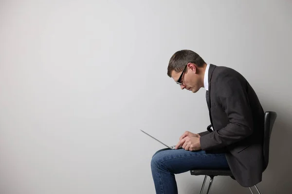 Man Poor Posture Using Laptop While Sitting Chair Grey Background ...
