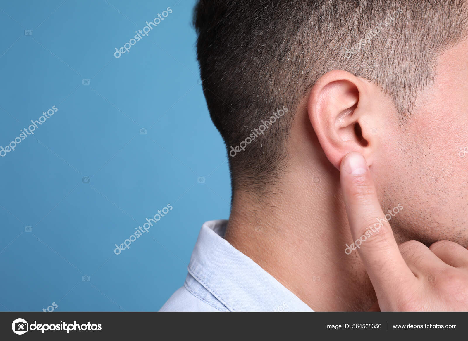 Man Pointing His Ear Light Blue Background Closeup Space Text Stock ...