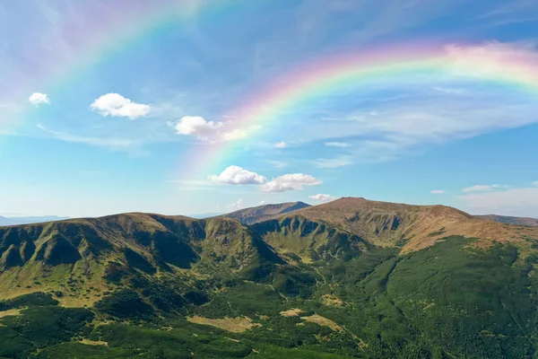 Rainbow over mountains Stock Photos, Royalty Free Rainbow over ...