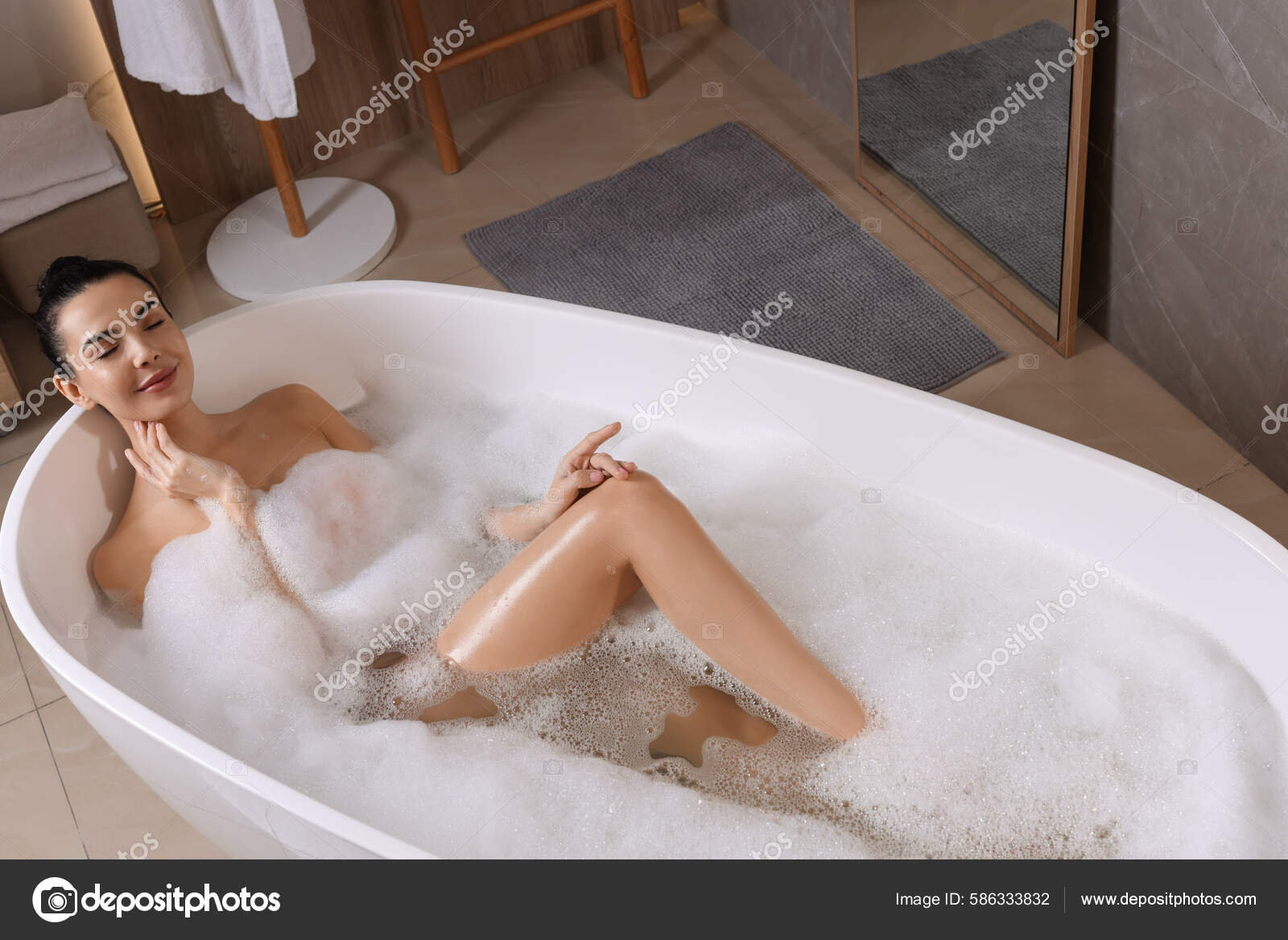 Woman Taking Bath Shower Gel Indoors View — Stock Photo © NewAfrica #586333832