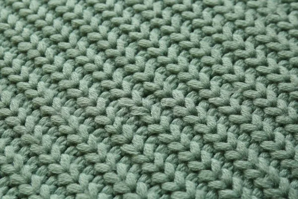 Beautiful pale green knitted fabric as background, closeup - Stock ...