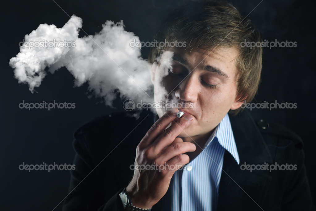 Man smoking a cigarette — Stock Photo © TERENTEV #18461389