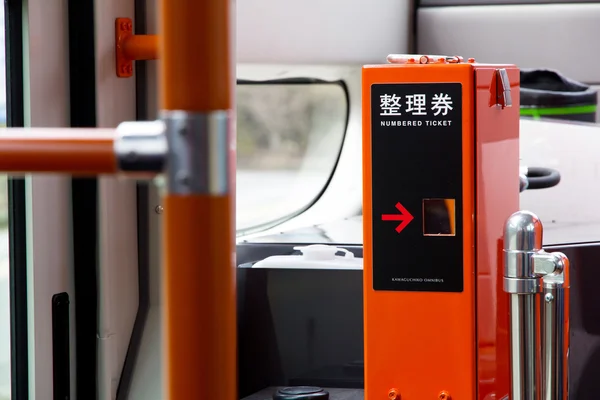 A ticket vending machine on the bus - Stock Image - Everypixel
