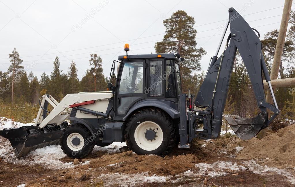 Wheel excavator digs pillar pylon Stock Photo by ©AleksandrNo 44936767