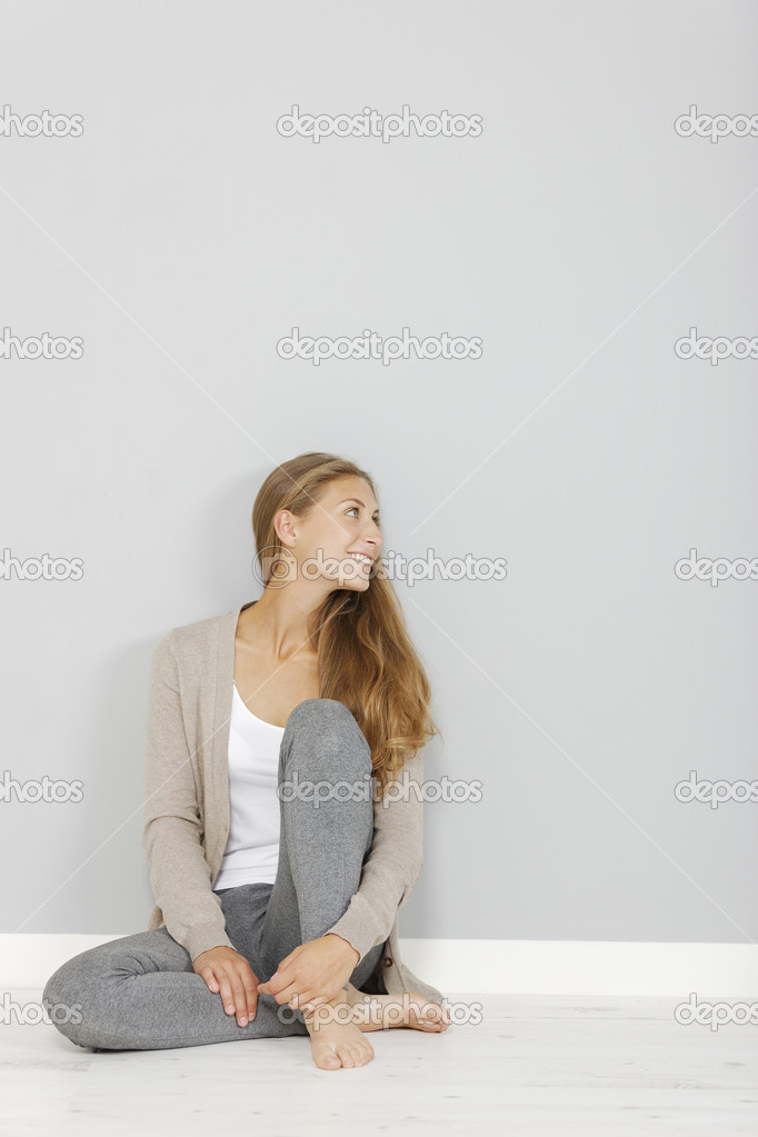 Woman Leaning Against Wall