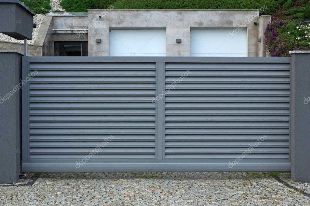 Elegant modern gate and garage in the background — Stock Photo ...