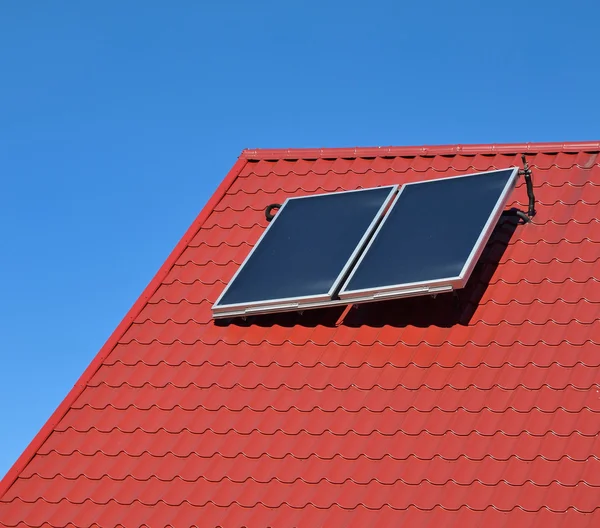 Solar panel on a red roof Stock Photo by ©kravka 29699173