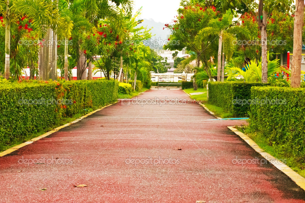 Red stone paved roads in the park — Stock Photo © singkamc #13388357
