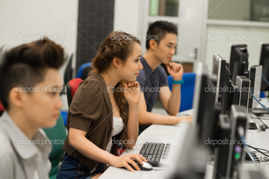 Working in a classroom — Stock Photo © DragonImages #23396692