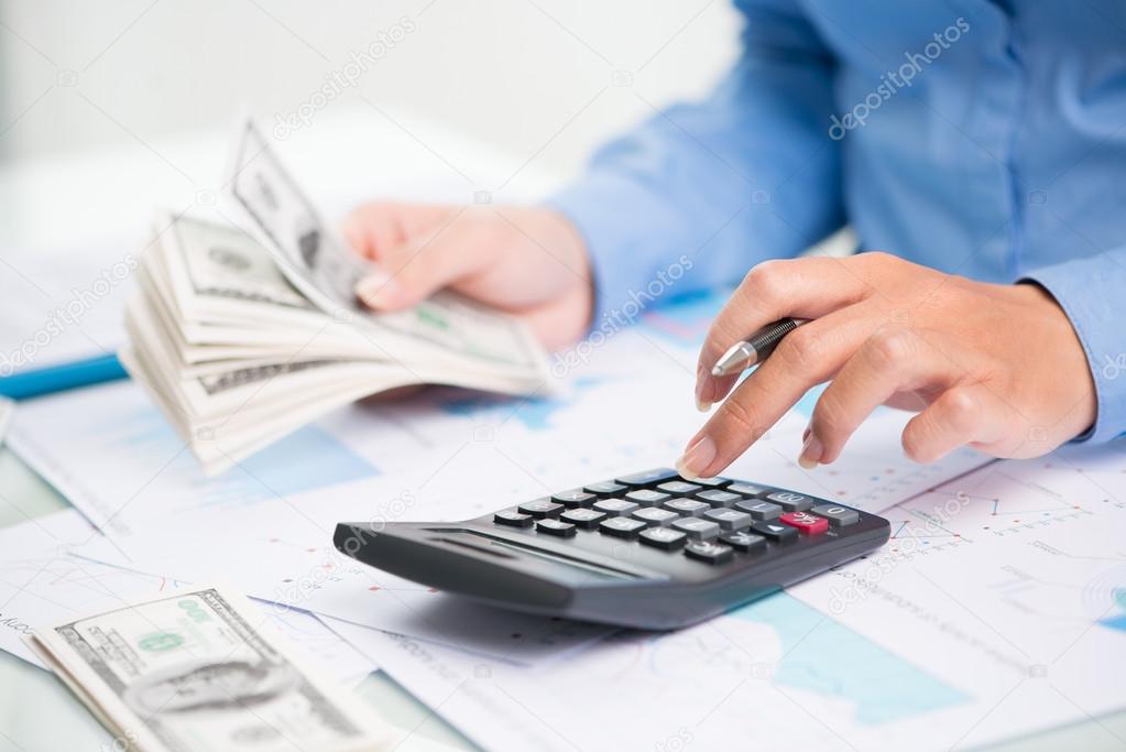 Counting money — Stock Photo © DragonImages #40343125