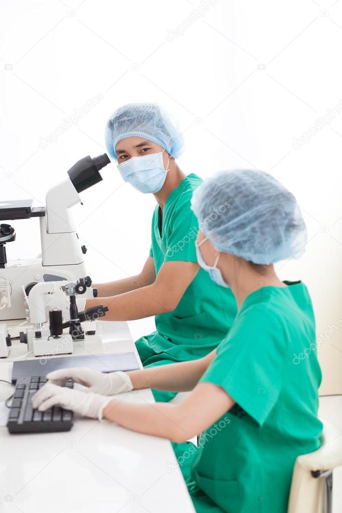 Two scientists doing research Stock Photo by ©DragonImages 50358917