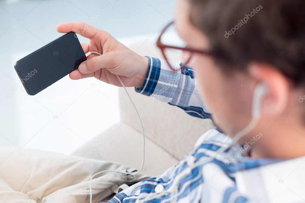 Man listening to the musing — Stock Photo © DragonImages #50359027