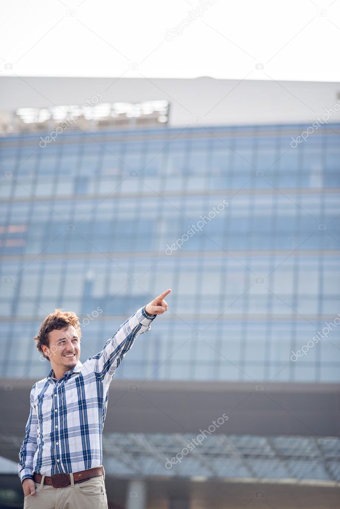 Man pointing in the sky — Stock Photo © DragonImages #50359047