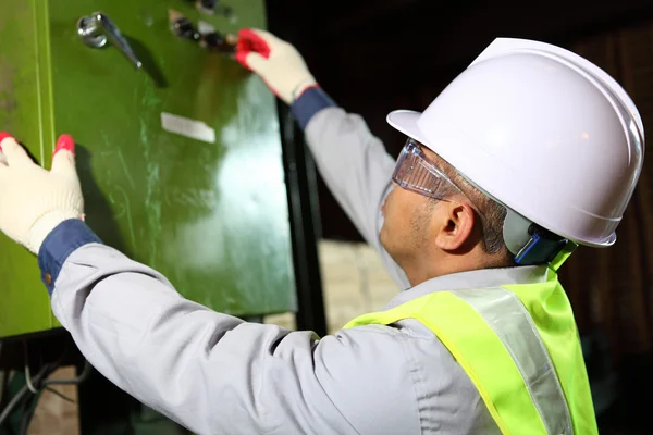 Electrician fitting a ceiling light — Stock Photo © photography33 #7392183