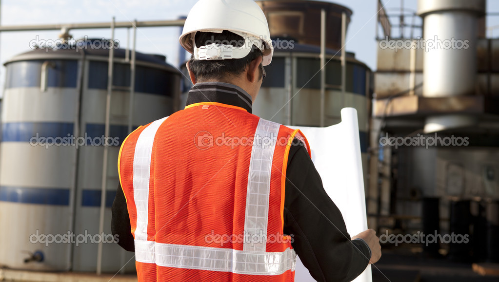 Engineer on location site with blueprint Stock Photo by ©ndoeljindoel ...