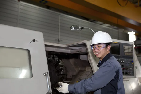 Mechanical technician of cnc machine Stock Photo by ©ndoeljindoel 18813531
