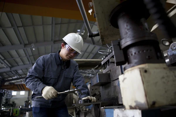 Mechanical technician of cnc machine Stock Photo by ©ndoeljindoel 18813531