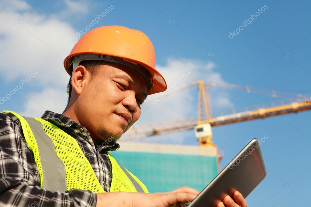 Construction worker using digital tablet — Stock Photo © ndoeljindoel ...