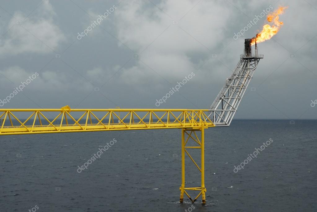 Flare boom nozzle and fire on offshore oil rig Stock Photo by ©kampee_p ...
