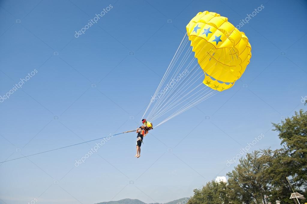 Parashoot yellow umbrella on the beach, phuket, thailand — Stock Photo ...