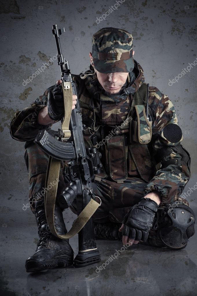 Soldier sitting on the floor — Stock Photo © Dualshock #38231523